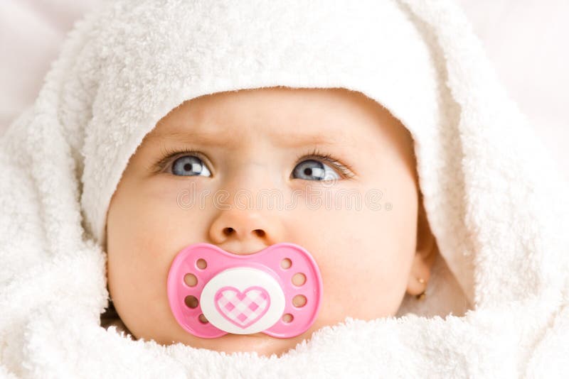 Baby girl with pacifier stock photo. Image of clothes - 5415890