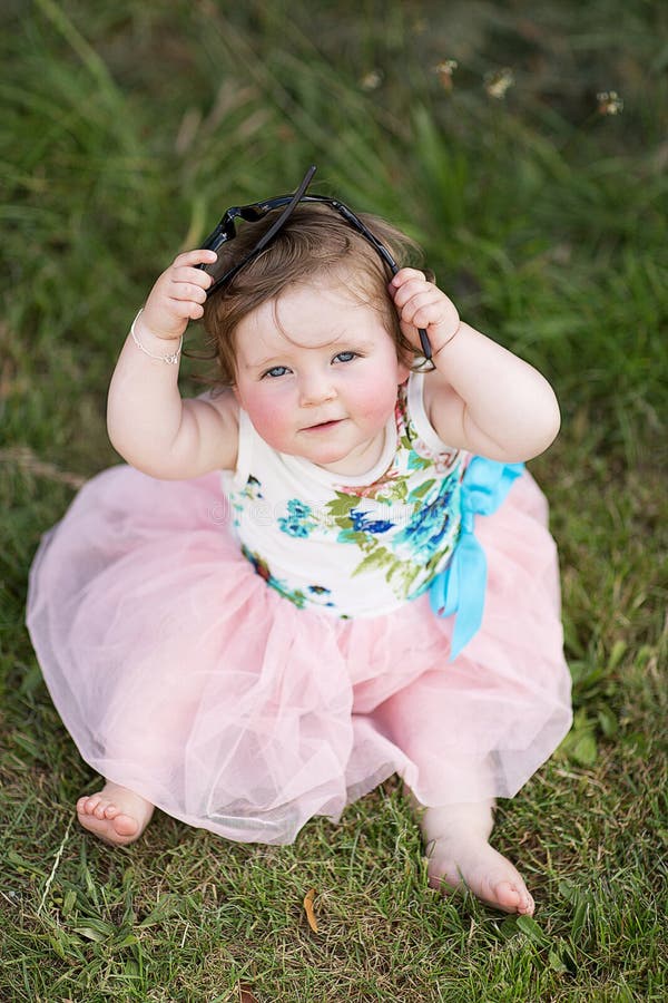 Baby Girl in Park stock image. Image of baby, grass, pink - 47486359
