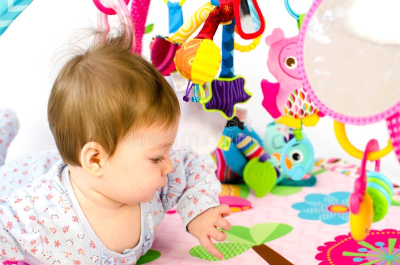 Baby Girl Playing in an Activity Gym Stock Photo - Image of fascination ...