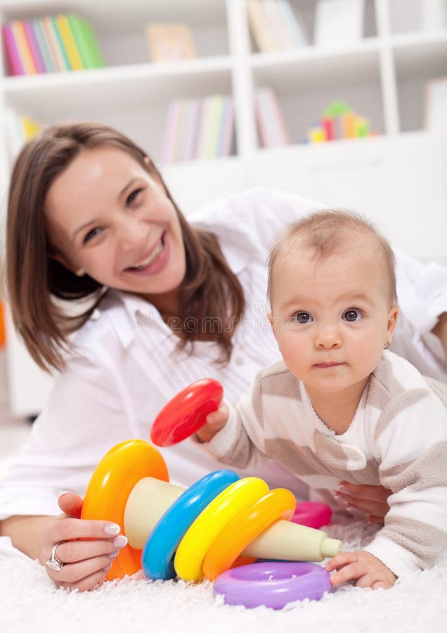 Baby Girl Playing on the Floor Stock Image - Image of home, care: 22997787