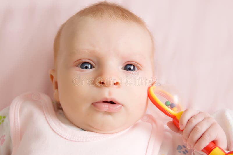 Baby Girl Playing with Rattle Stock Image - Image of baby, portrait ...