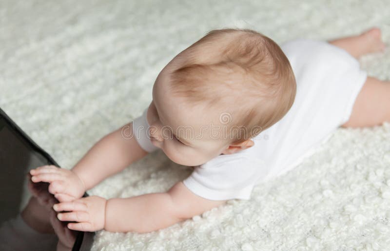 Baby using digital tablet stock image. Image of behavior - 28863655