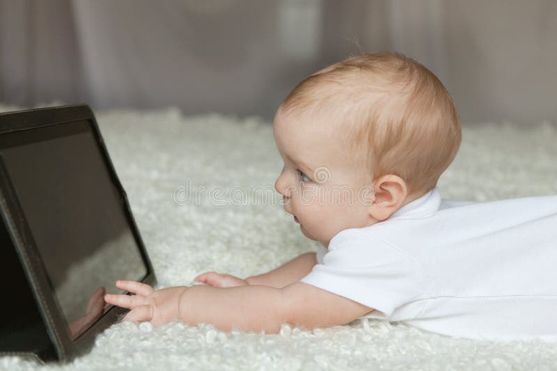 Baby using digital tablet stock image. Image of behavior - 28863655