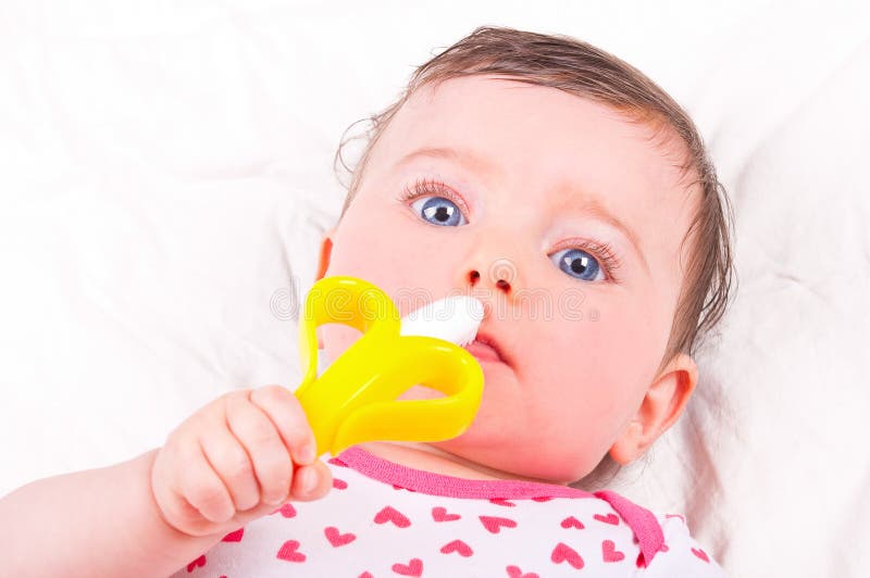 Baby Girl with Rattle Teether Toy. Stock Photo - Image of cute, child ...
