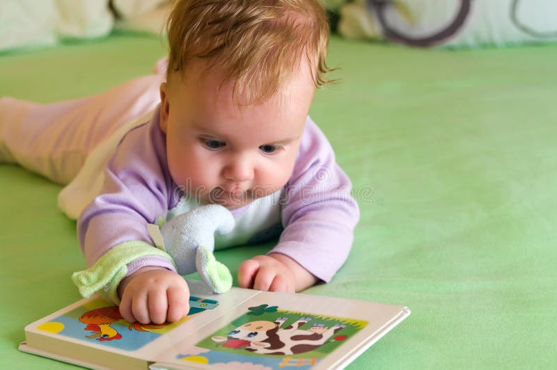 Baby girl reading stock photo. Image of white, smiling - 15932870