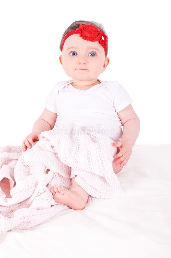 Baby girl with red ribbon. stock image. Image of baby - 73033231
