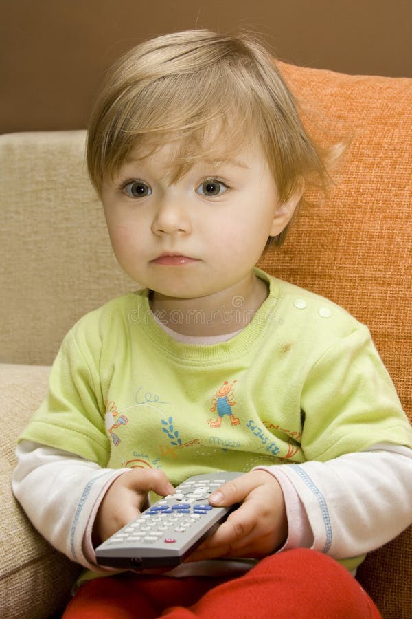 Baby Girl with Remote Control Stock Photo - Image of control, channel ...