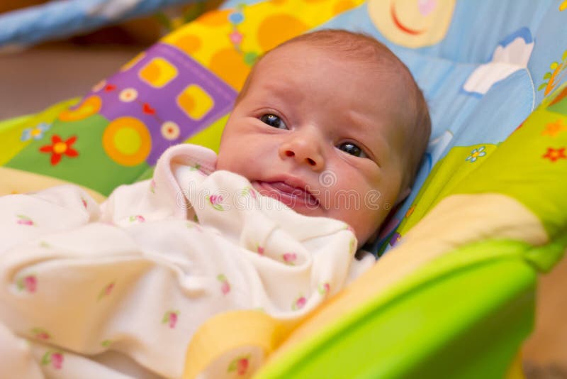 Baby girl in rocker stock image. Image of caucasian, baby - 27997525