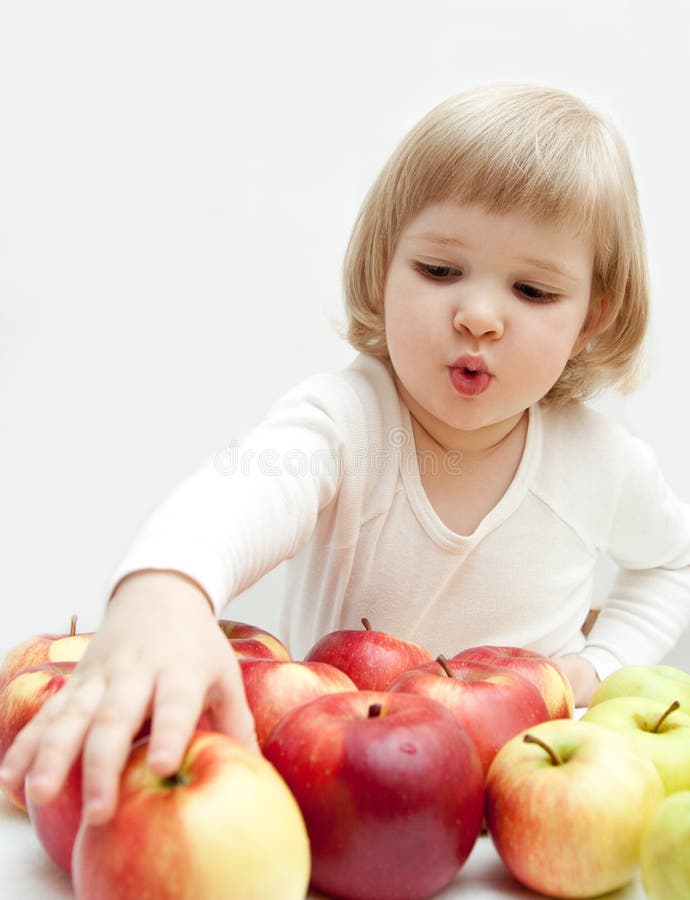 The Baby Girl is Selecting a Red Apple Stock Photo - Image of white ...