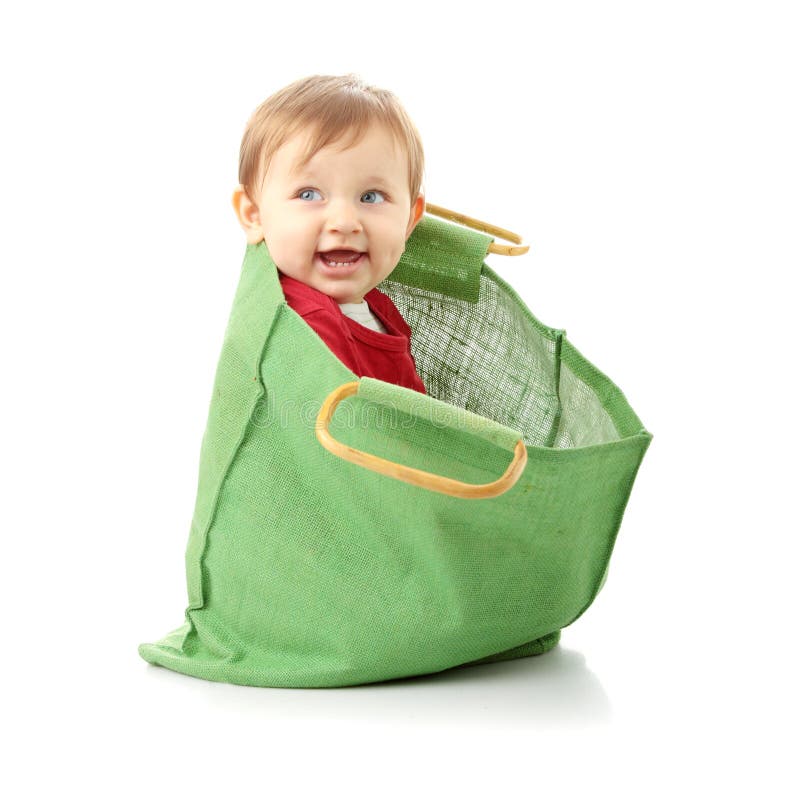 Baby girl in shopping bag stock image. Image of sitting - 12476371
