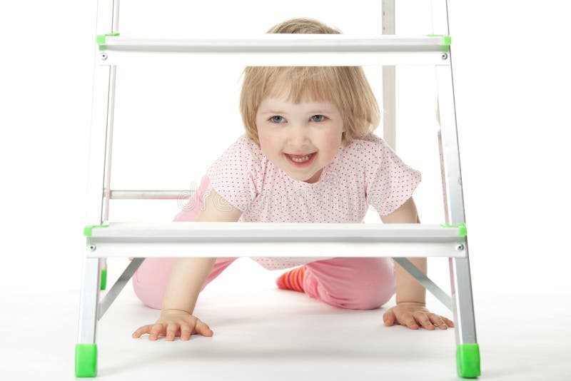 The Baby Girl is Sitting Under a Stepladder Stock Image - Image of ...
