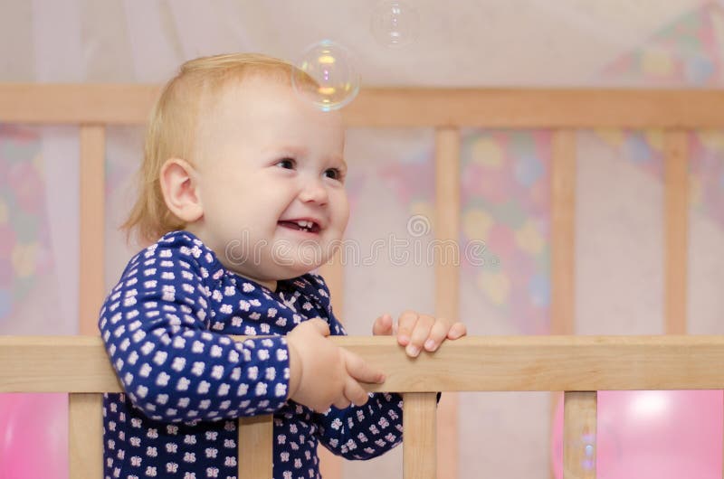 Baby girl and soap bubbles stock image. Image of smile - 33810603