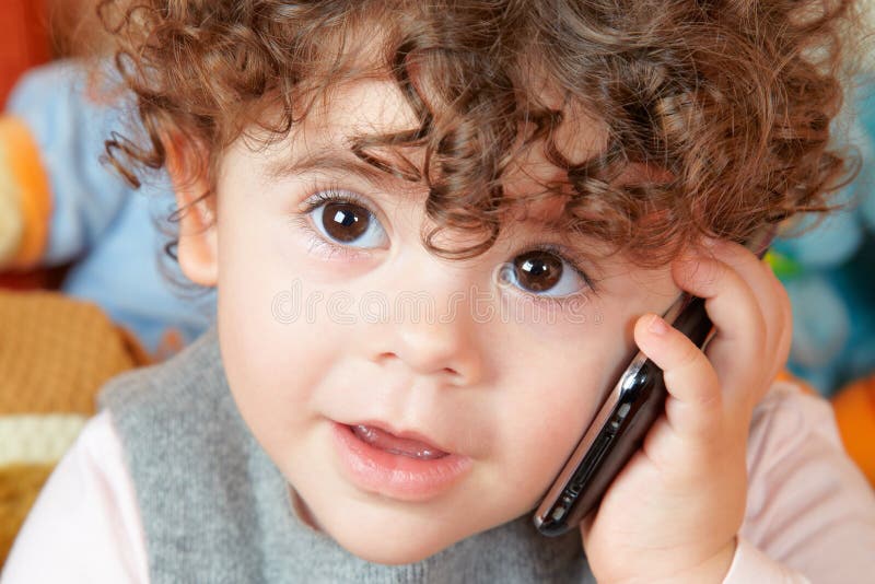 Baby girl talking on phone stock image. Image of little - 28839399