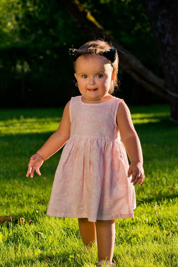 Baby Girl Walking on the Lawn in the Park Stock Image - Image of face ...