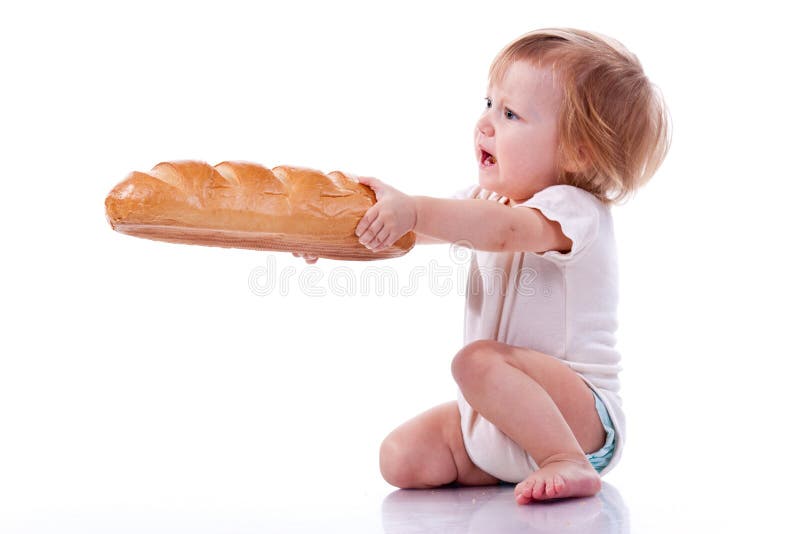 Hungry child eating bread stock image. Image of emotions - 44041255
