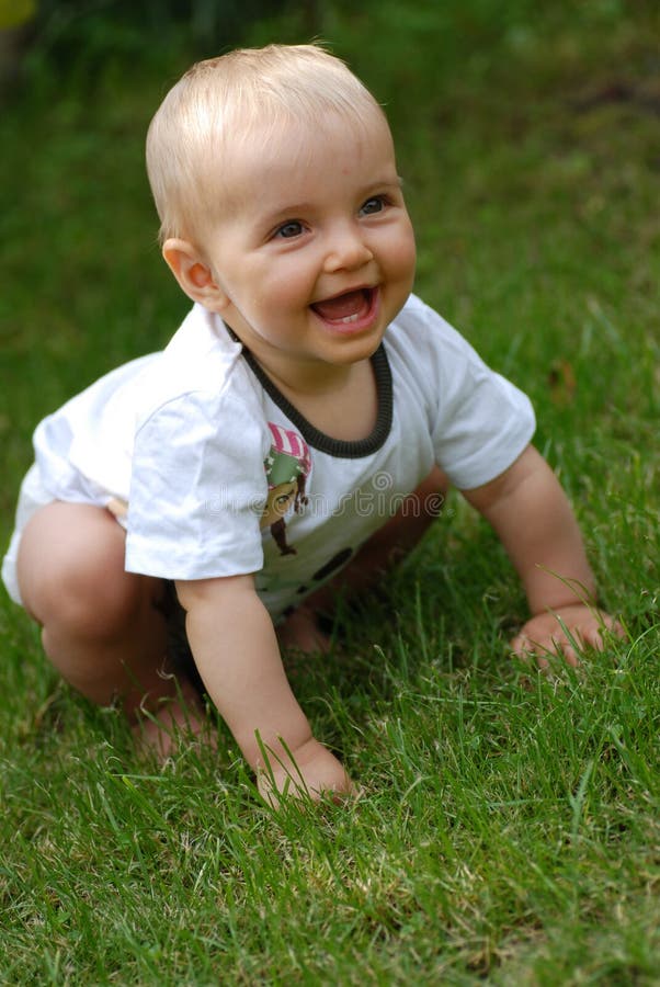 Baby on grass stock image. Image of human, looking, brightly - 7732445