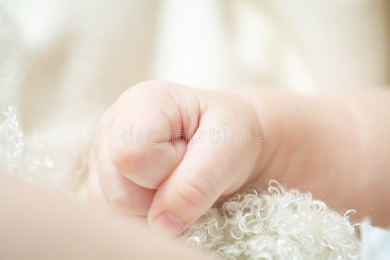 Baby s hand holding pearls stock photo. Image of confidence - 37488576