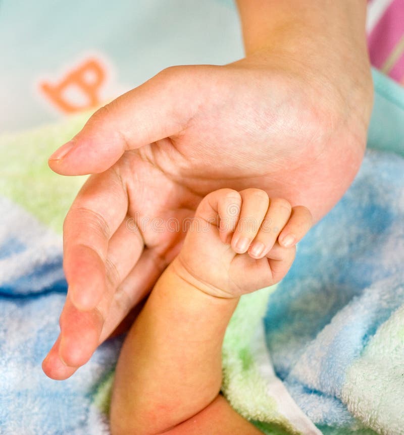 Baby hand in mother's palm stock image. Image of peaceful - 22700503