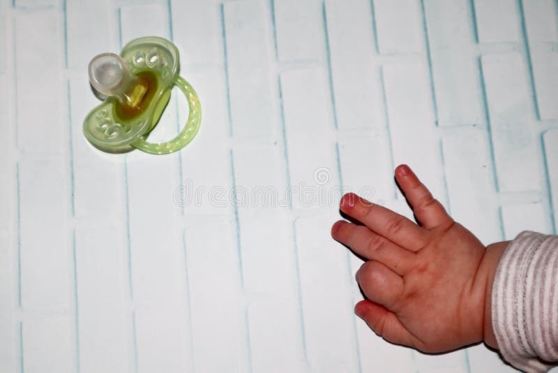 Baby Hand Reaching for a Pacifier Closeup Stock Image - Image of person ...