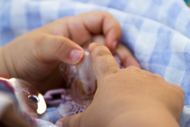 Baby Hands Catching a Pacifier Stock Photo - Image of travel, baby ...