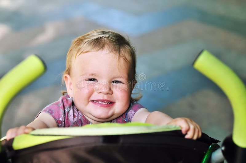 Baby Having Fun in the Stroller Stock Photo - Image of joyful, activity ...