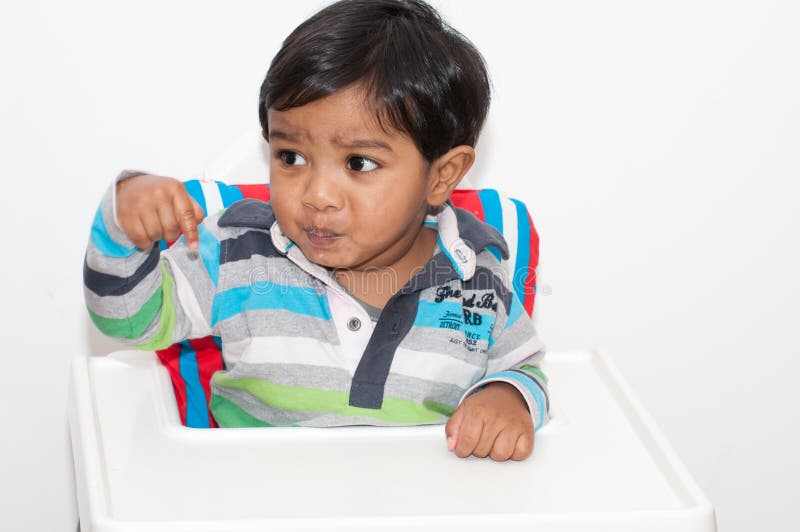 Baby in a high chair stock photo. Image of look, high - 24719798
