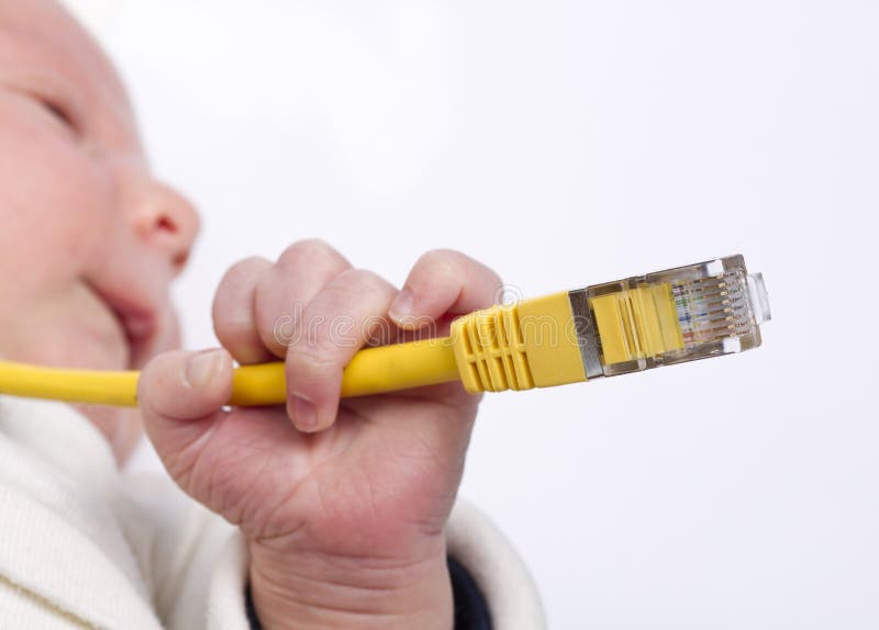 Baby holding network cable stock photo. Image of information - 22188958