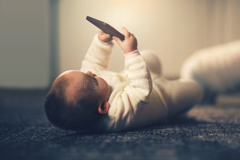 Baby holding smart phone stock photo. Image of cheerful - 85127526