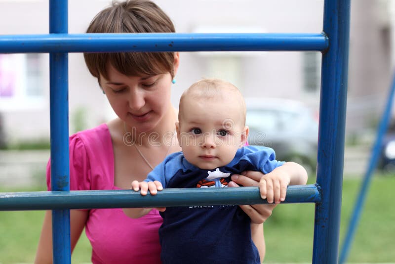 Baby on ladder stock image. Image of holding, ladder - 25751403