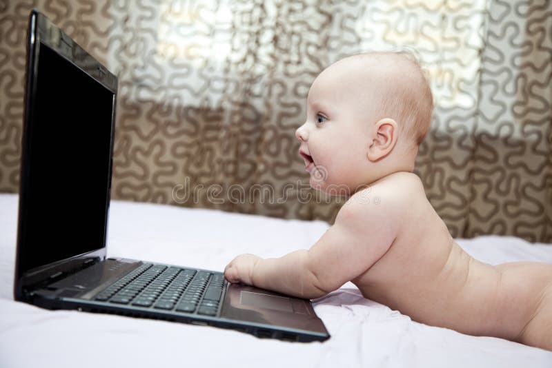 Baby a laptop. stock image. Image of computers, making - 29139163