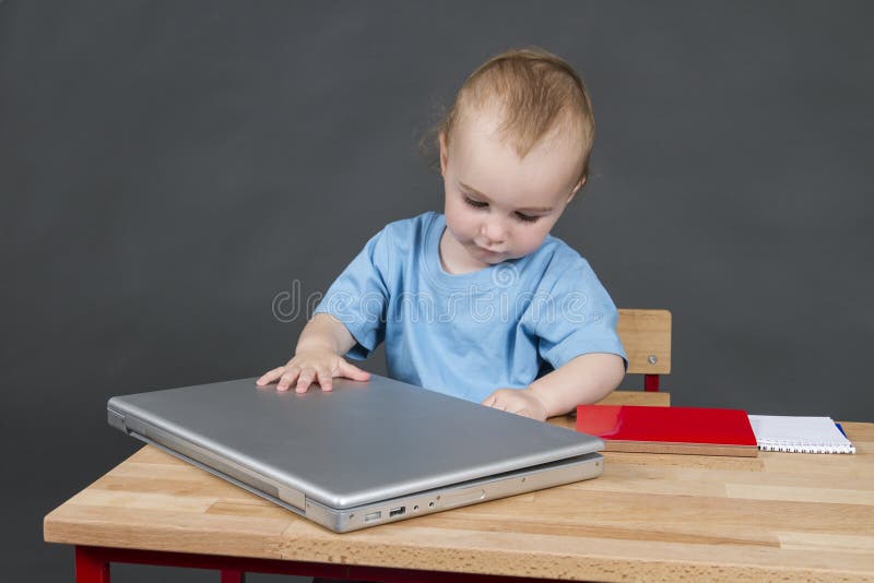 Baby with Laptop Computer in Grey Background Stock Image - Image of ...