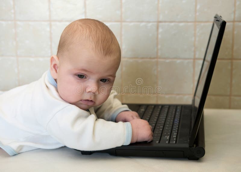 Baby with laptop stock photo. Image of charming, simulation - 85759720