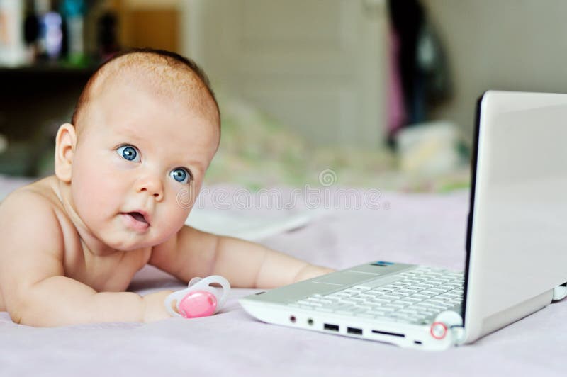 Baby with laptop stock photo. Image of happiness, play - 63177932