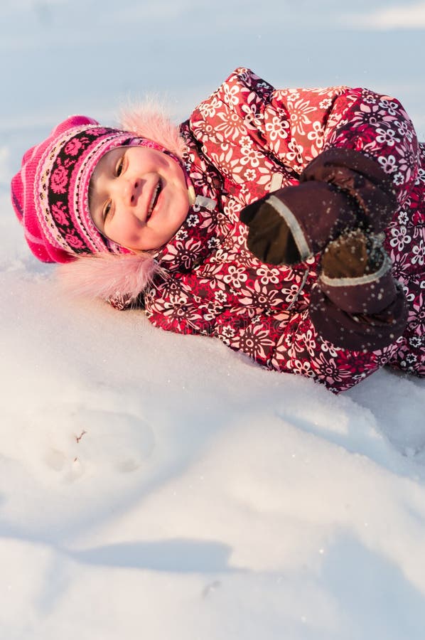 Baby Lays on Snow and Laugh Stock Photo - Image of seasonal, happy ...