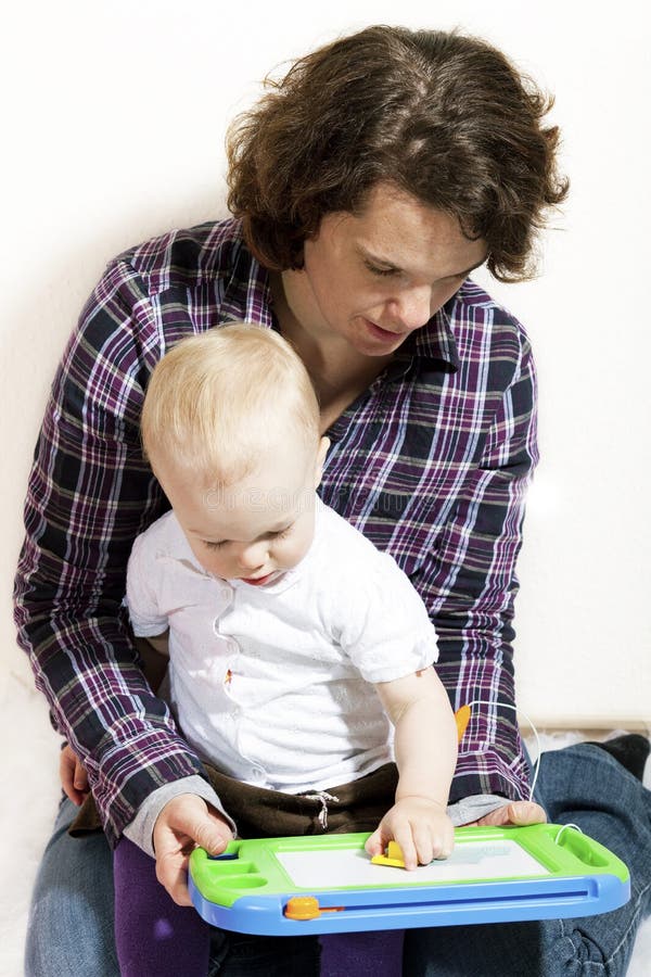 Baby learning drawing stock image. Image of affection - 23546943