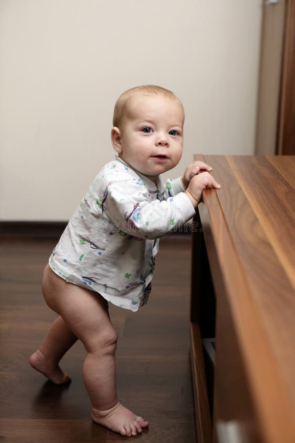Baby learning to stand stock photo. Image of cute, learning - 62560328