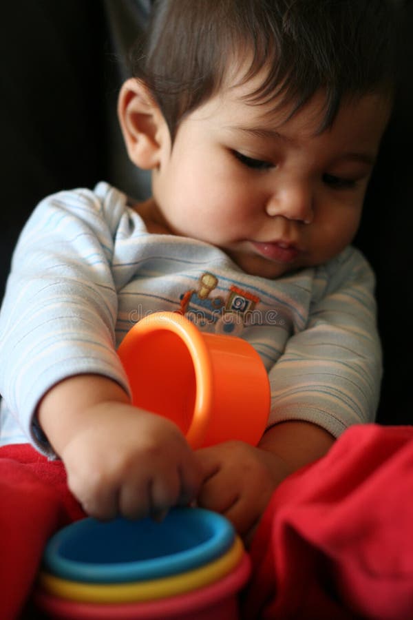 Baby Learning To Use His Hands Stock Image - Image of intent, black ...