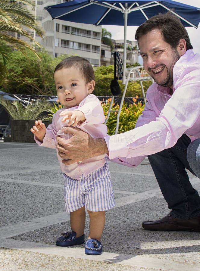 Baby learning to walk stock image. Image of relationship - 71776919