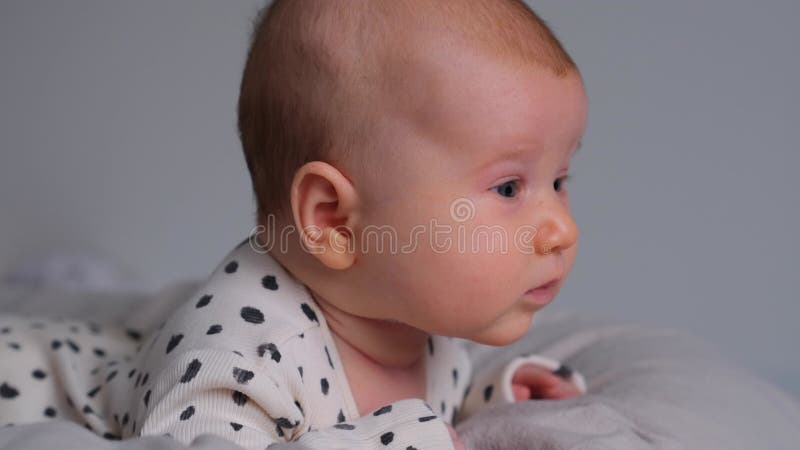 Baby Looking Around and Exploring the World in Cradle at Home Stock ...