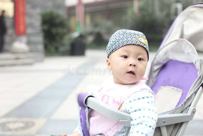 Baby looking back stock image. Image of hand, pretty - 46157395