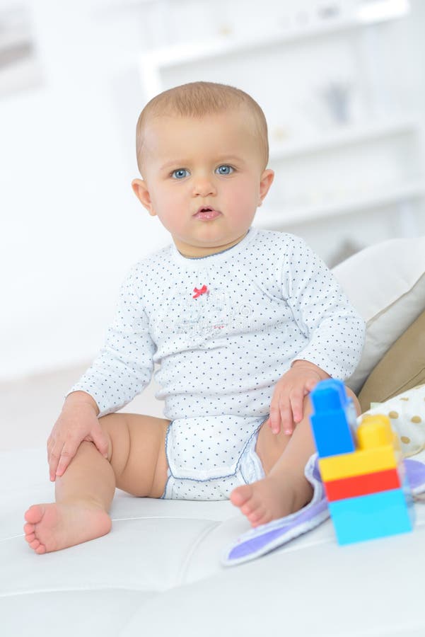 Baby looking at camera stock photo. Image of dumbbell - 164149834