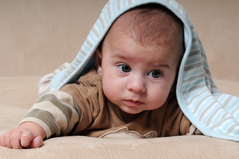 Baby Looking Out from Under Blanket Stock Photo - Image of childhood ...