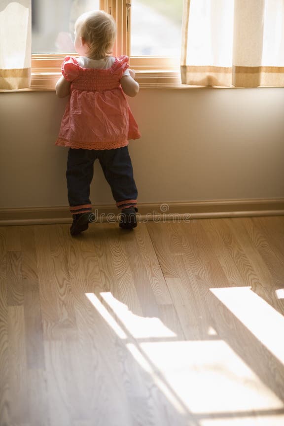 Baby looking out window stock photo. Image of child, toes - 5137444
