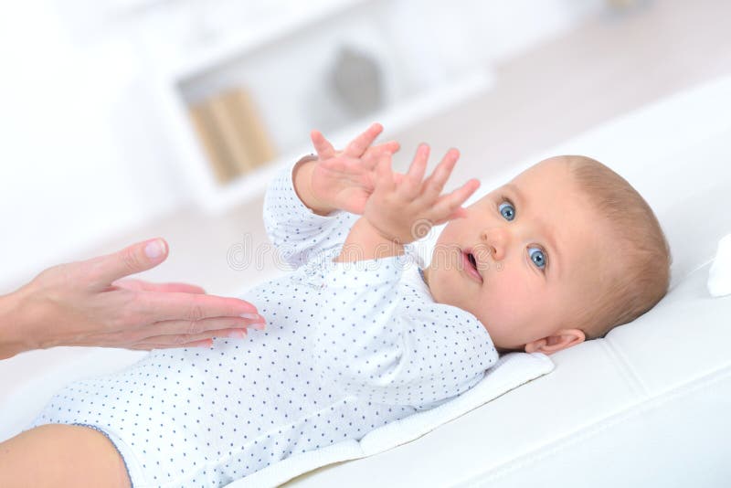 Baby lying on back stock image. Image of palms, healthy - 123593471