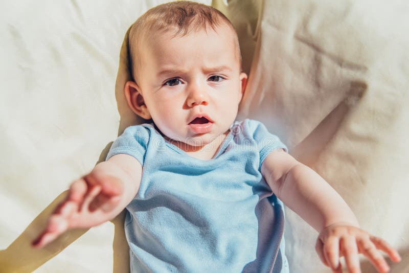 Baby Lying in the Sun Angry and Crying Calling His Parents Stock Image ...