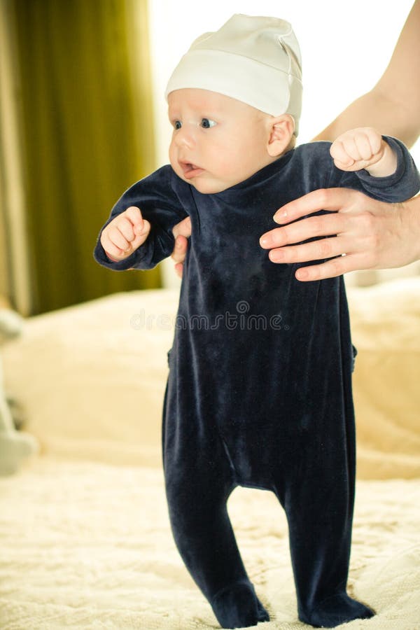 Baby makes first steps stock image. Image of emotion, fluffy - 8812271