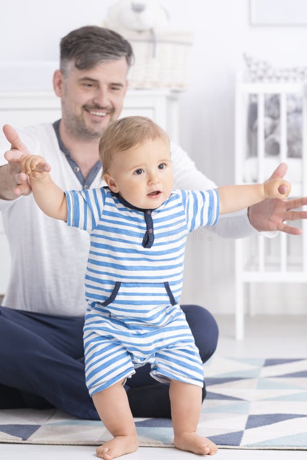 Baby Making First Steps with Father Stock Image - Image of leave ... Baby Making First Steps with Father Stock Image - Image of leave ...