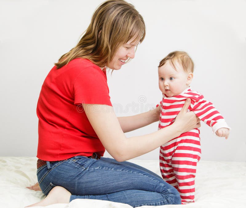 Baby making first steps stock image. Image of child, mommy - 39320455