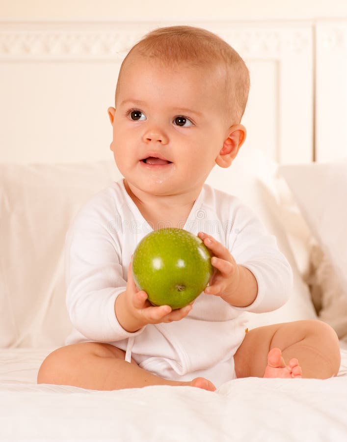 Baby Manipulating Green Apple Stock Photo - Image of caucasian ...