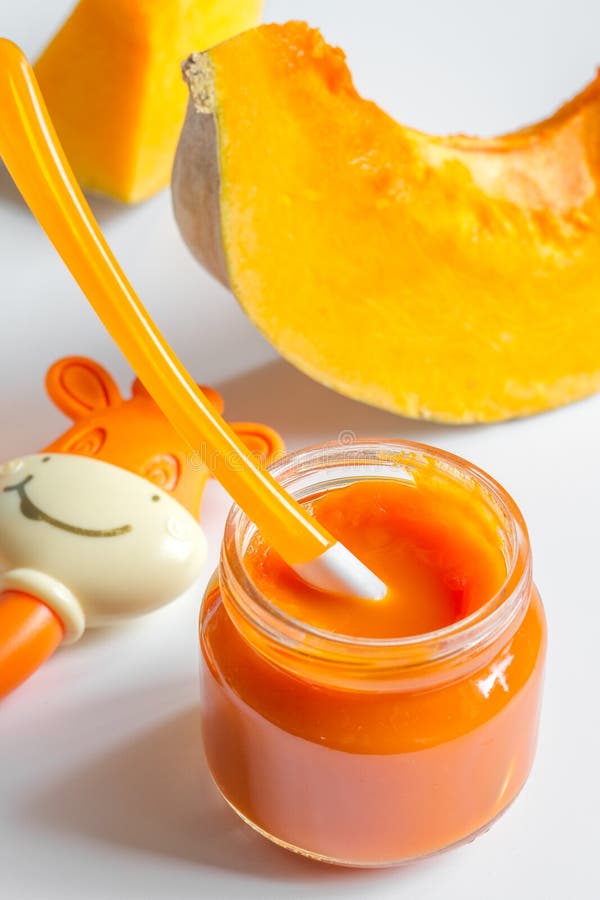Baby Mashed with Spoon in Glass Jar on White Background Stock Image ...